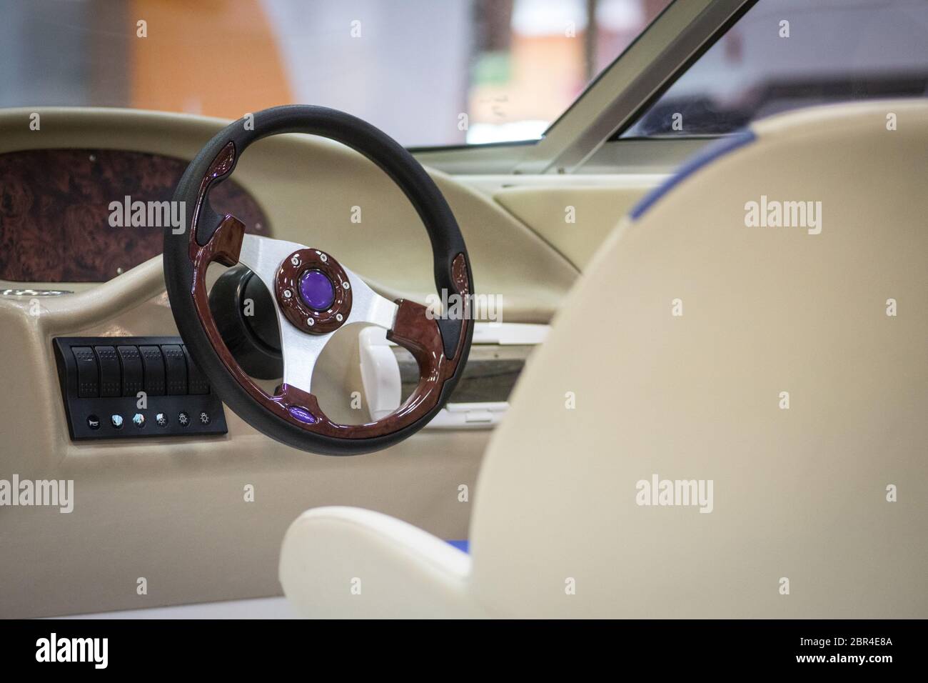 Color image of a speed boat steering wheel Stock Photo - Alamy