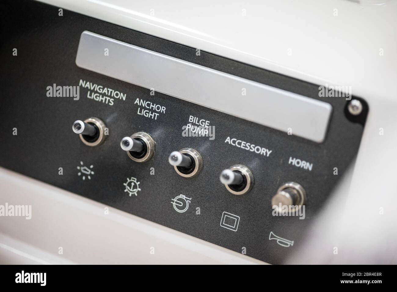 Close up shot with a control panel with switches in a luxury speed boat ...