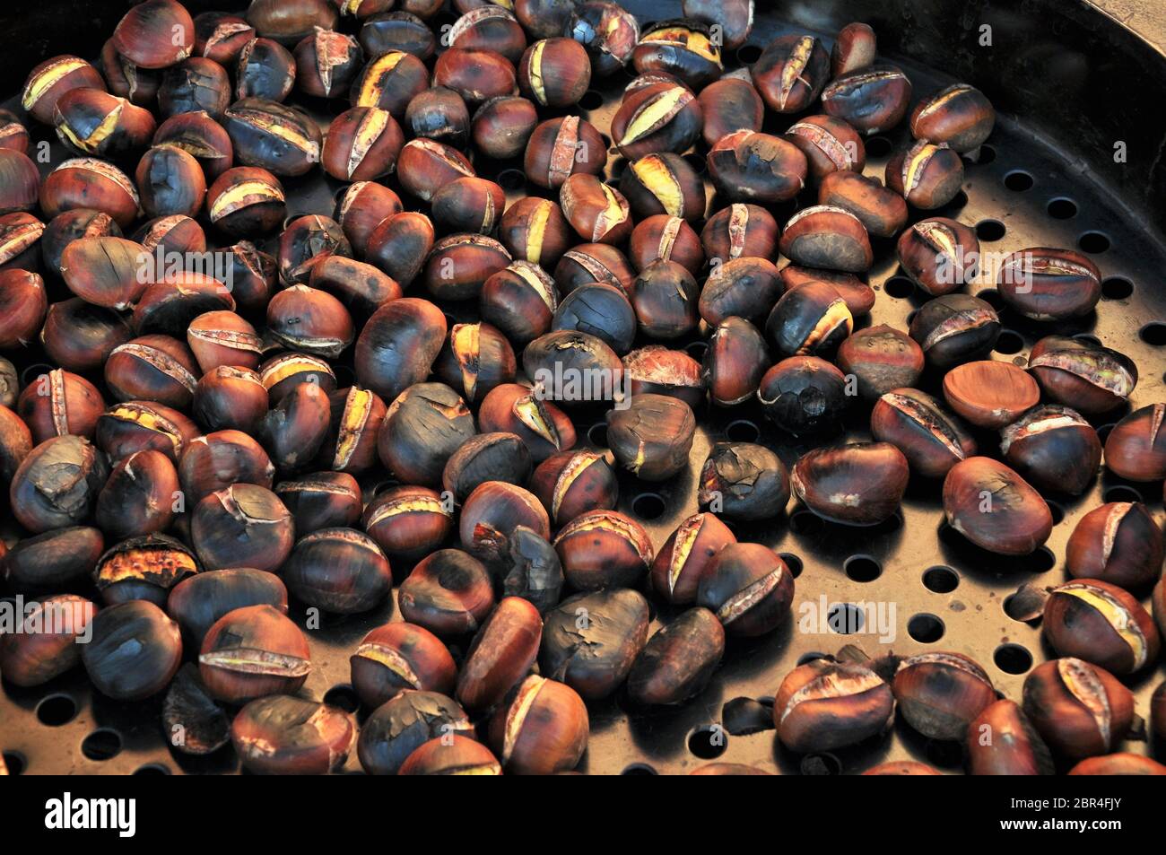Roasted chestnuts on the street at Christmastime. Traditional Street ...