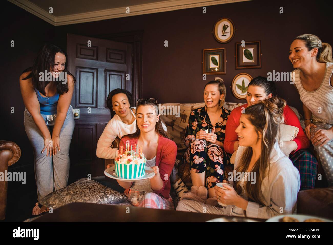Small group of female friends celebrating a birthday with a Birthday ...