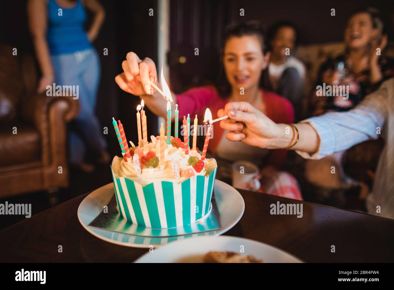 Small group of female friends celebrating a birthday with a Birthday ...