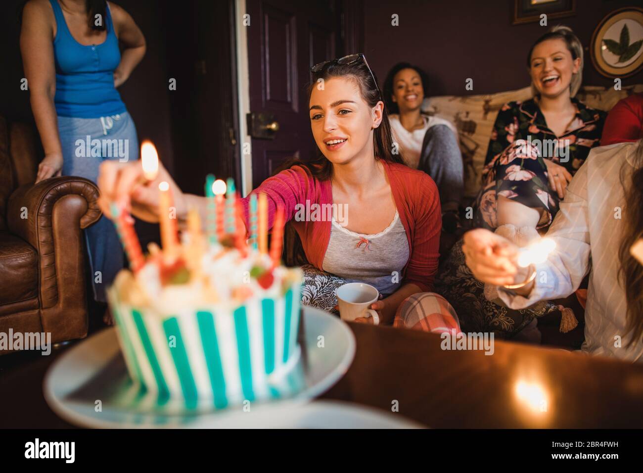 Small group of female friends celebrating a birthday with a Birthday ...