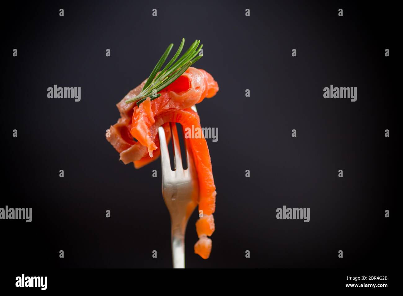 Salty red fish on fork hi-res stock photography and images - Alamy