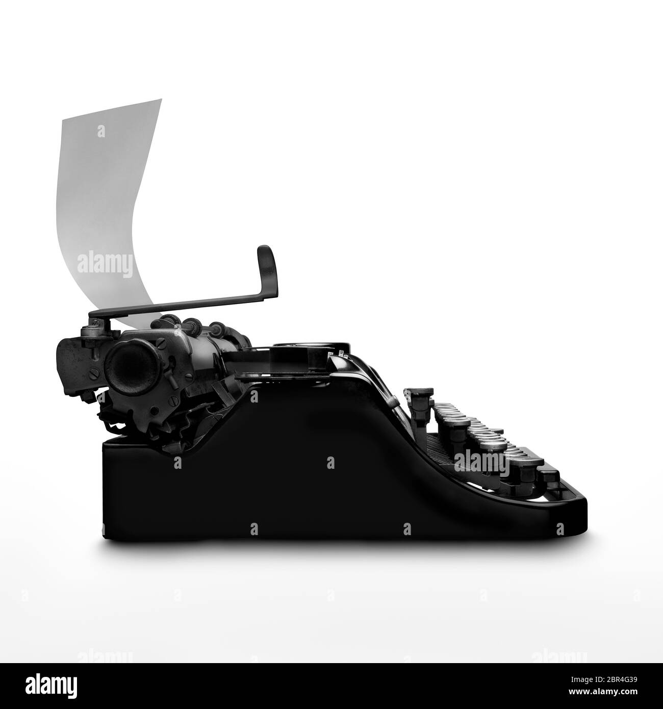 Low key photography of a typewriter with paper page against white ...