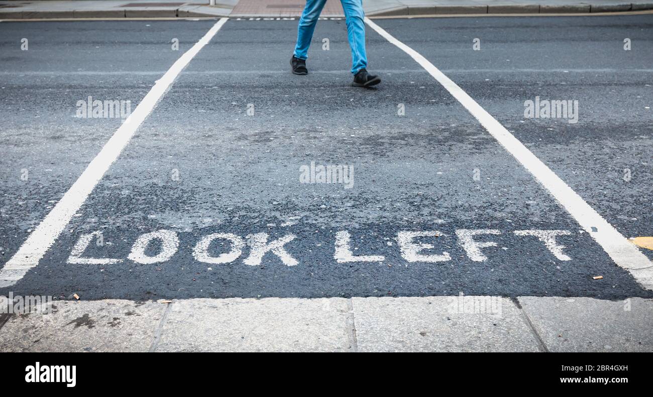 Pedestrian crossing look left sign hi-res stock photography and images ...