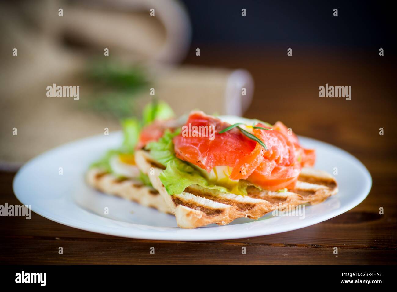 fried bread toast with salad leaves and salted red fish Stock Photo - Alamy