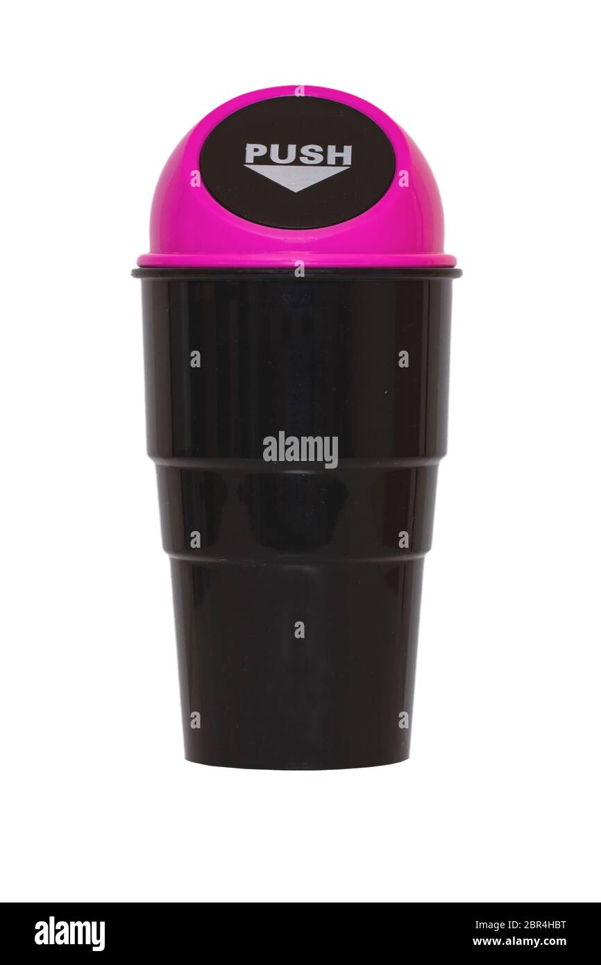 Garbage bins isolated. Closeup of a black plastic trash can bin with ...