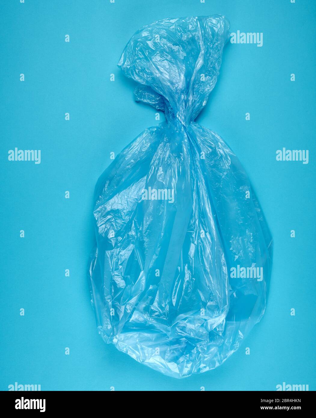 empty blue plastic bag for garbage on a blue background, top view Stock ...