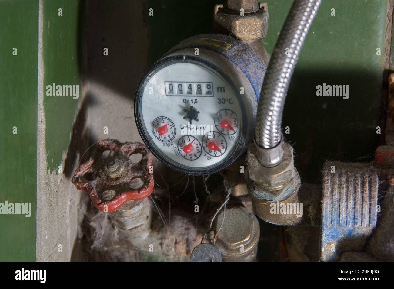 Very dirty water meter somewhere in house cellar Stock Photo - Alamy