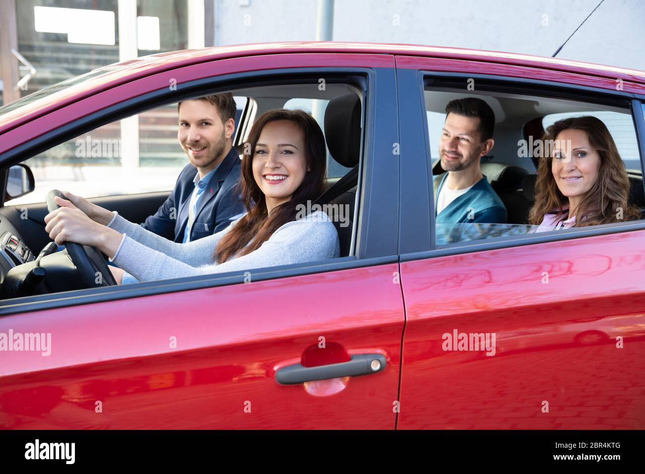 Group Of Happy Friends Having Fun In The Car Stock Photo - Alamy