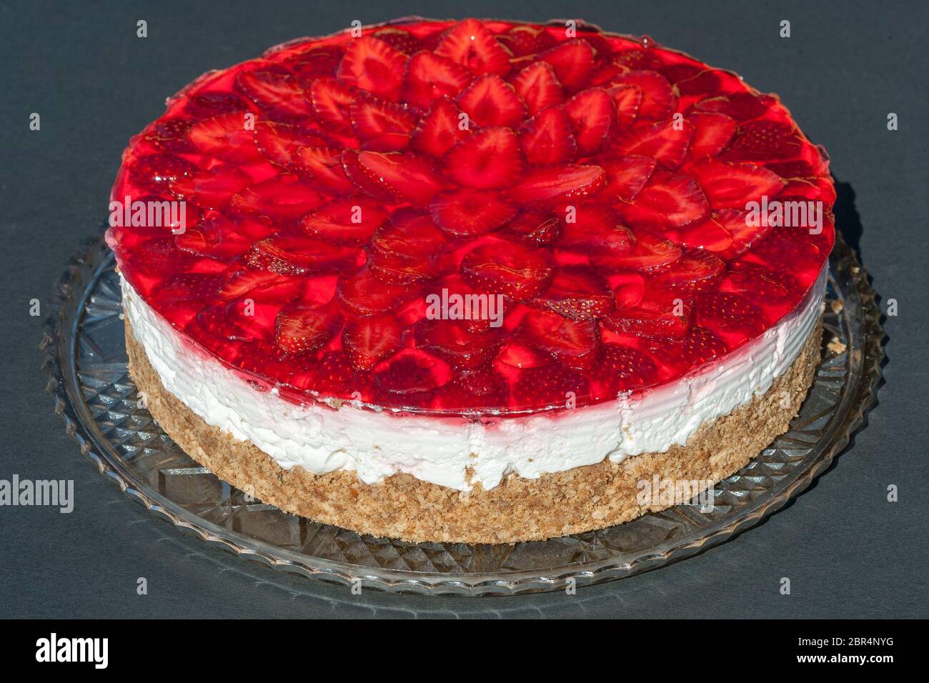 Strawberry cheesecake with fresh sliced strawberries perfectly arranged ...