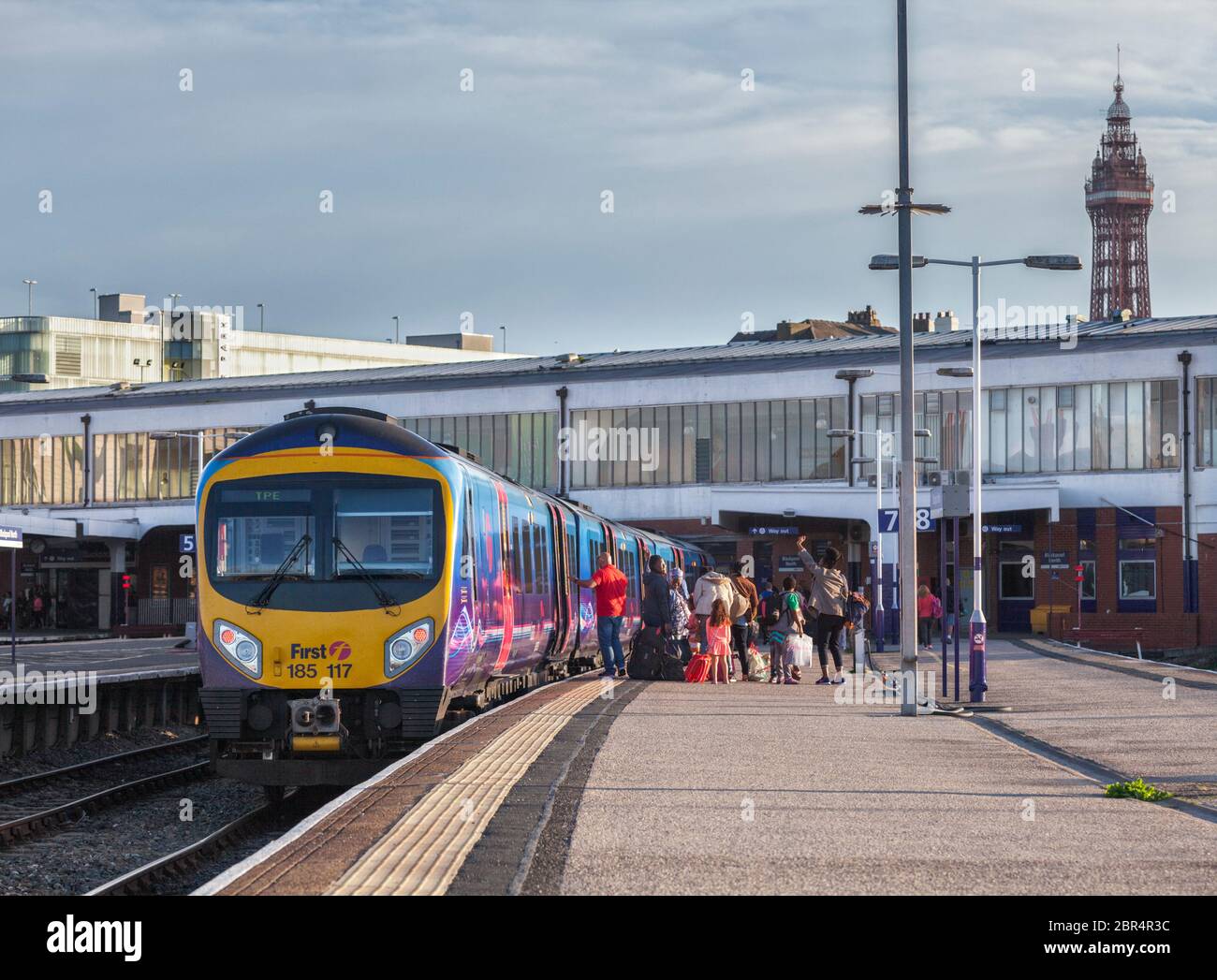 Rail passengers leaving a Firstgroup Transpennine Express train at Blackpool North railway ...