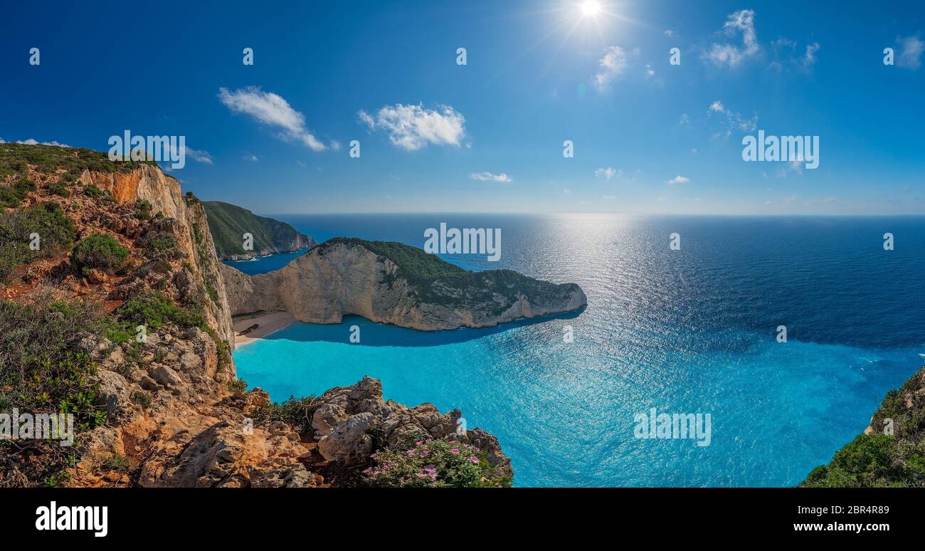 Panoramic view of the sun shining over cliffs in Shipwreck Cove in ...