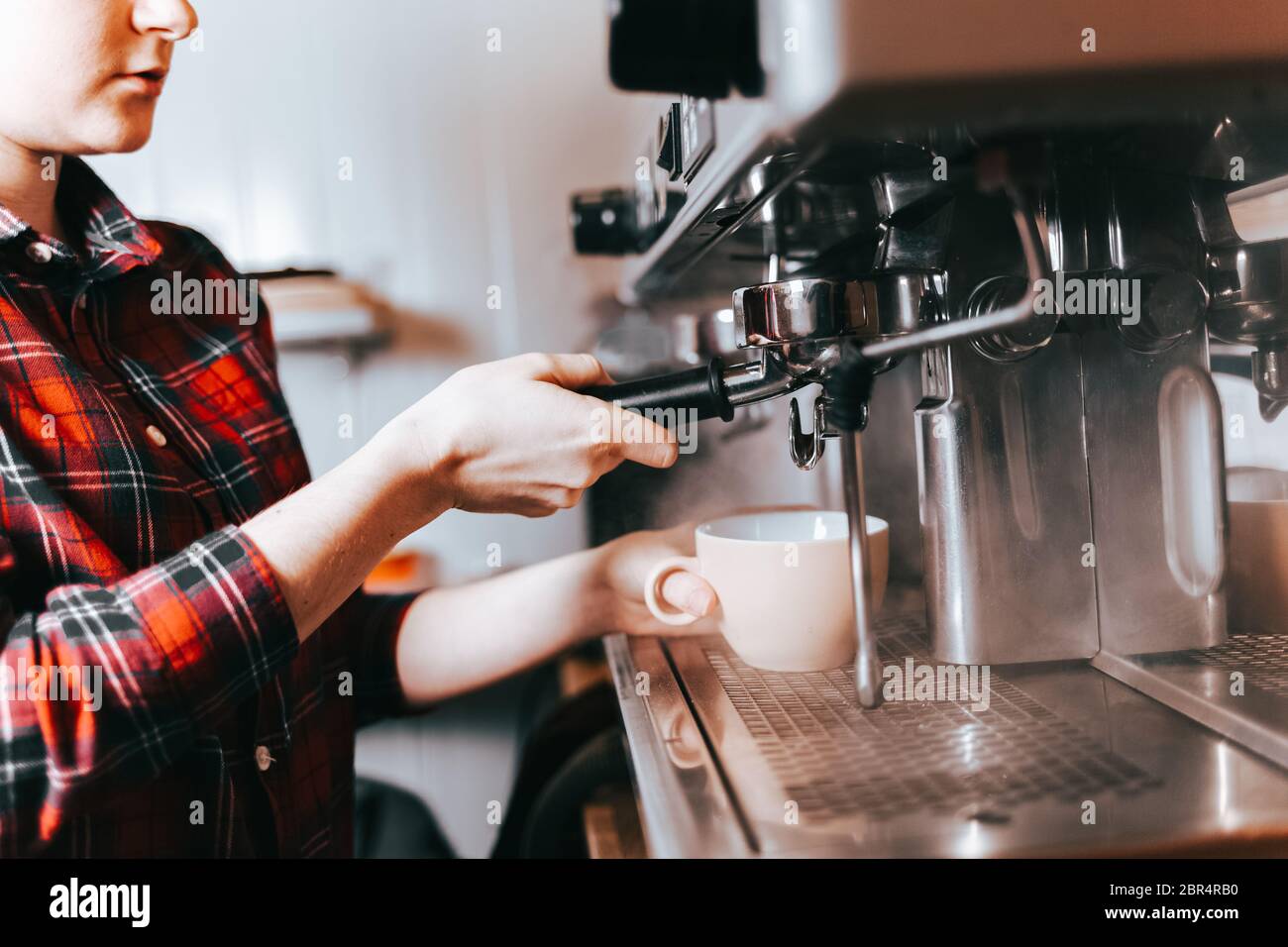 Barista makes aromatic coffee. Process of making latte on a coffee ...