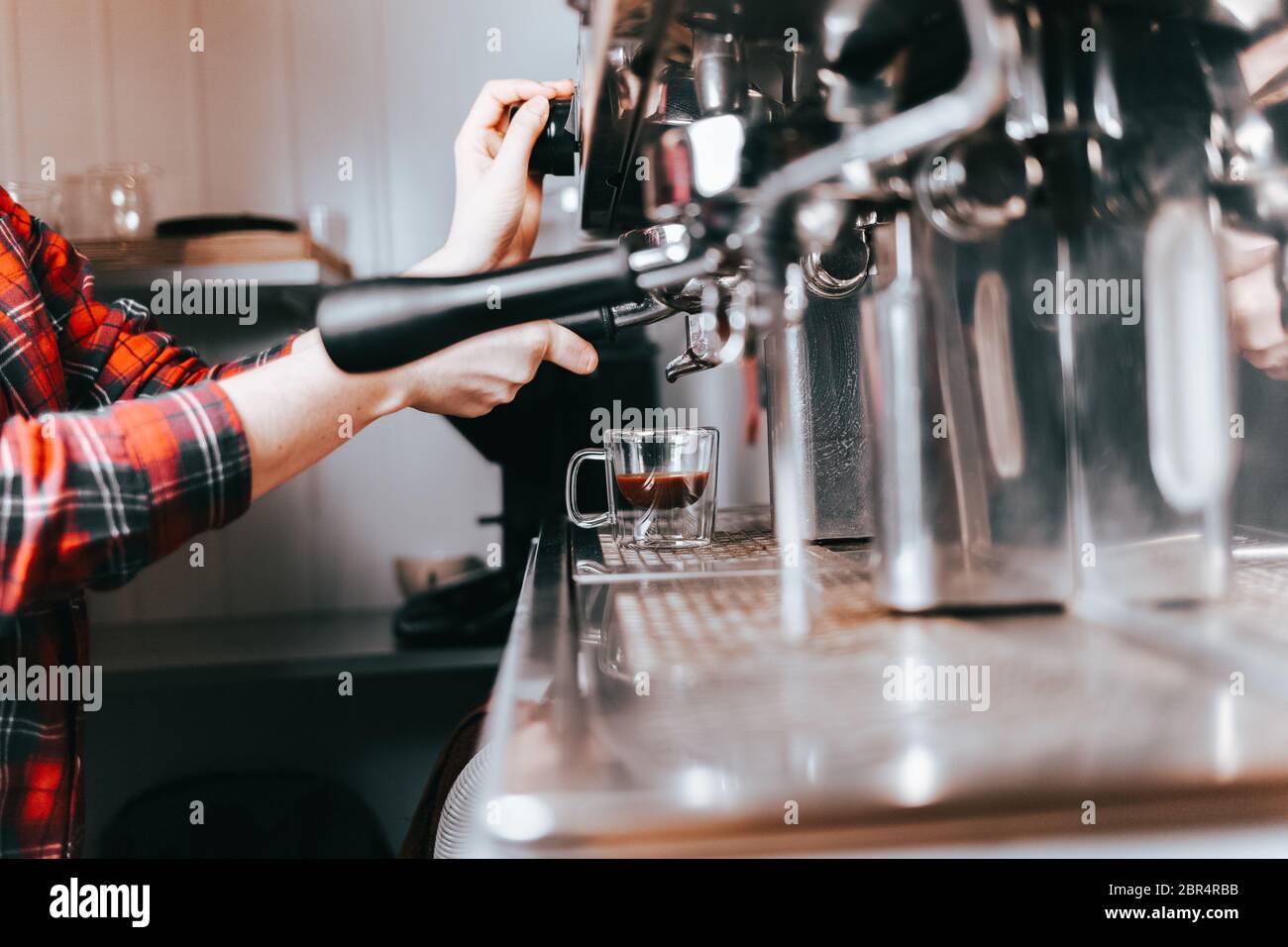 Barista makes aromatic coffee. Process of making latte on a coffee ...