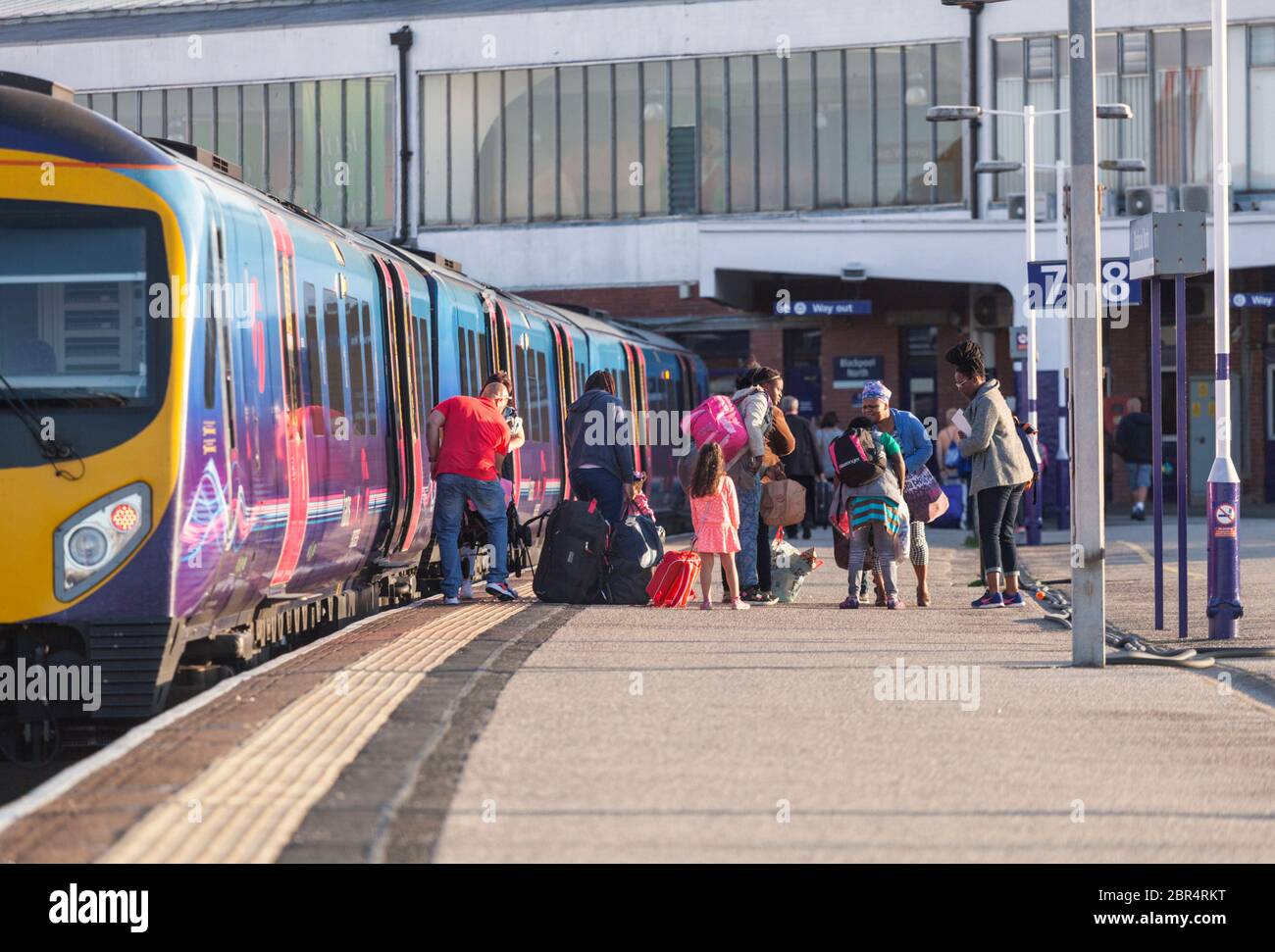 Rail passengers leaving a Firstgroup Transpennine Express train at ...