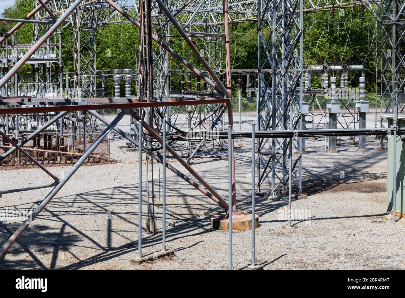 An array of ground supports, trusses, and insulators at an electrical ...