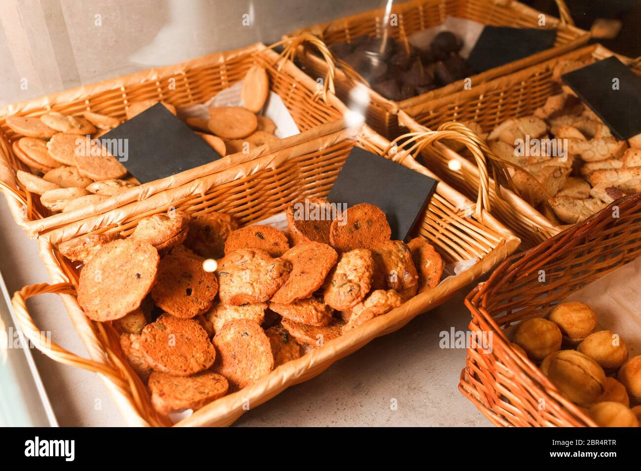 Variety of cookies on the counter of a pastry shop. Pastries in a ...