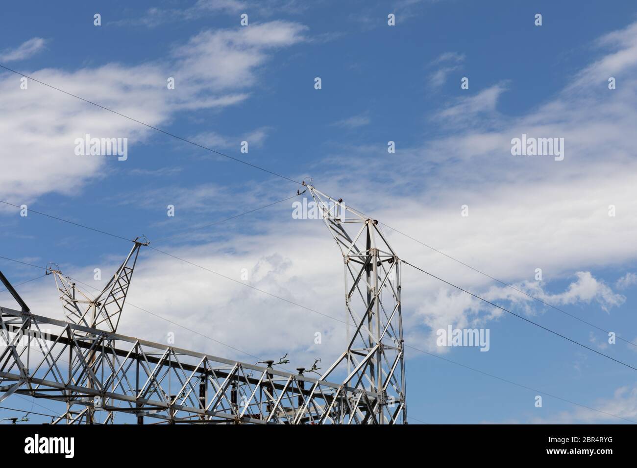 Electrical power lines entering a power transfer station, gridded ...