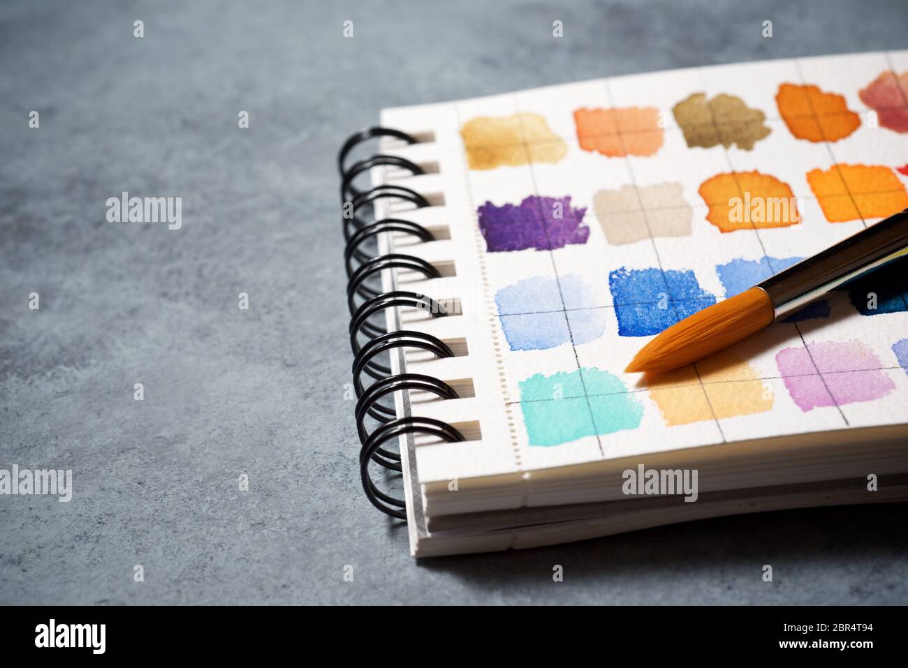 Watercolor test card on a sketchpad Stock Photo - Alamy