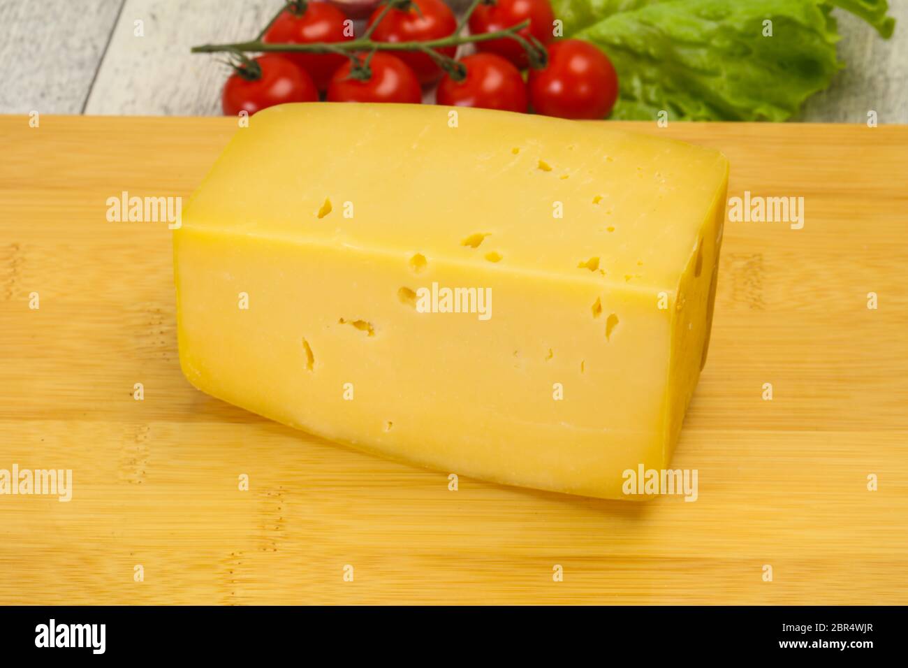 Swiss Hard yellow tasty cheese brick Stock Photo - Alamy