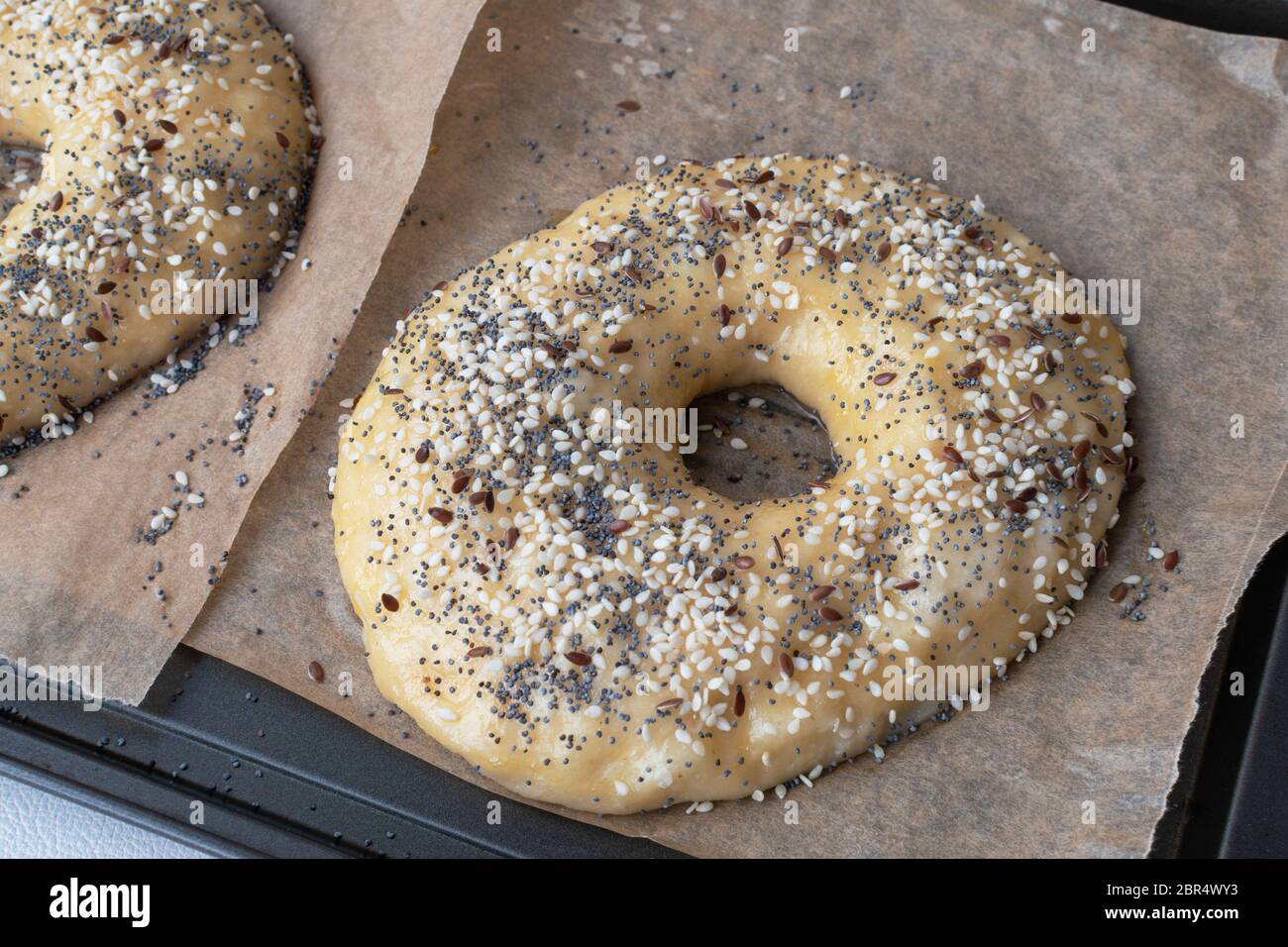 homemade preparation bagel with seeds Stock Photo - Alamy