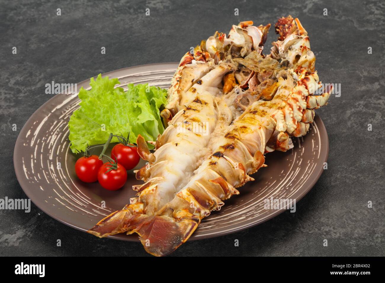 Grilled crayfish in the plate served salad Stock Photo - Alamy