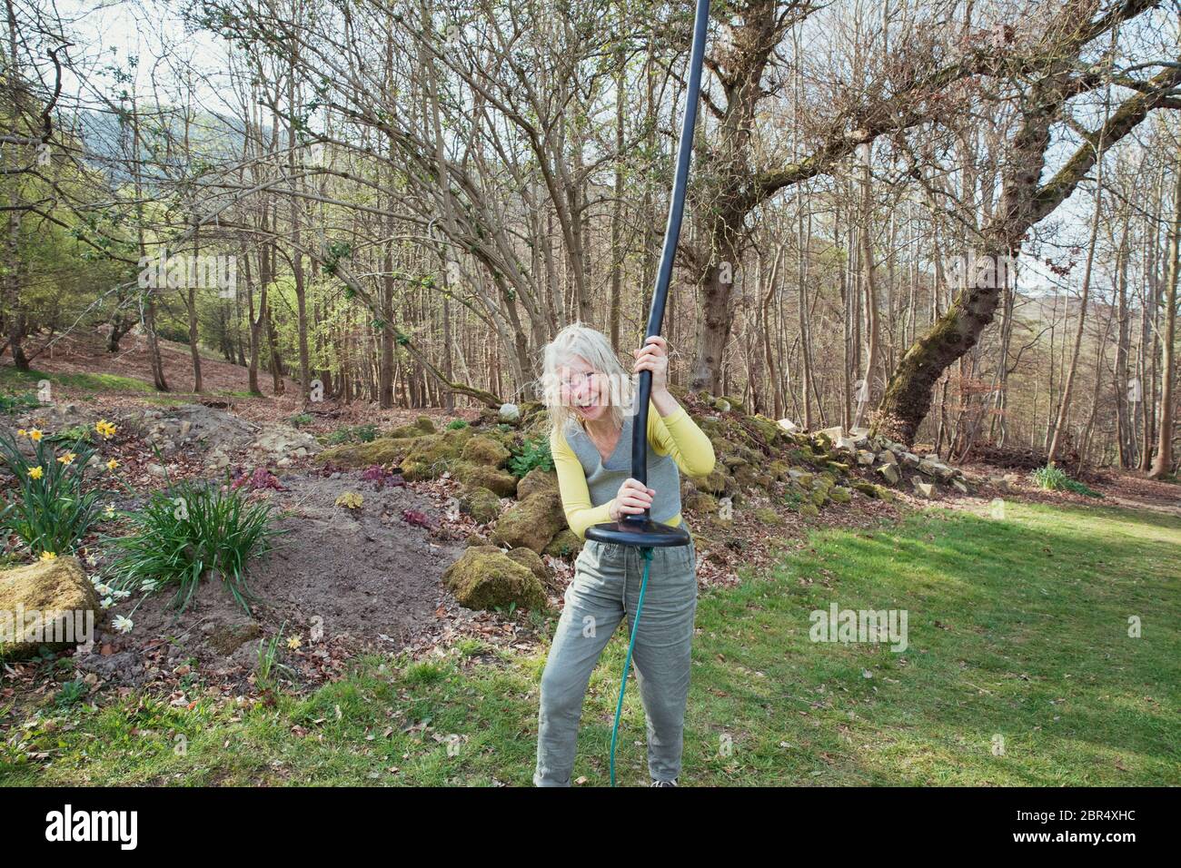 Senior woman is smiling for the camera after having a ride on a monkey ...
