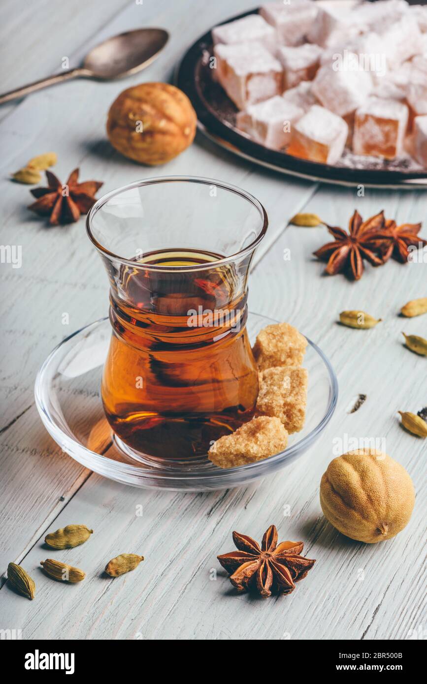 Tea in arab glass with turkish delight Rahat Lokum and different spices ...
