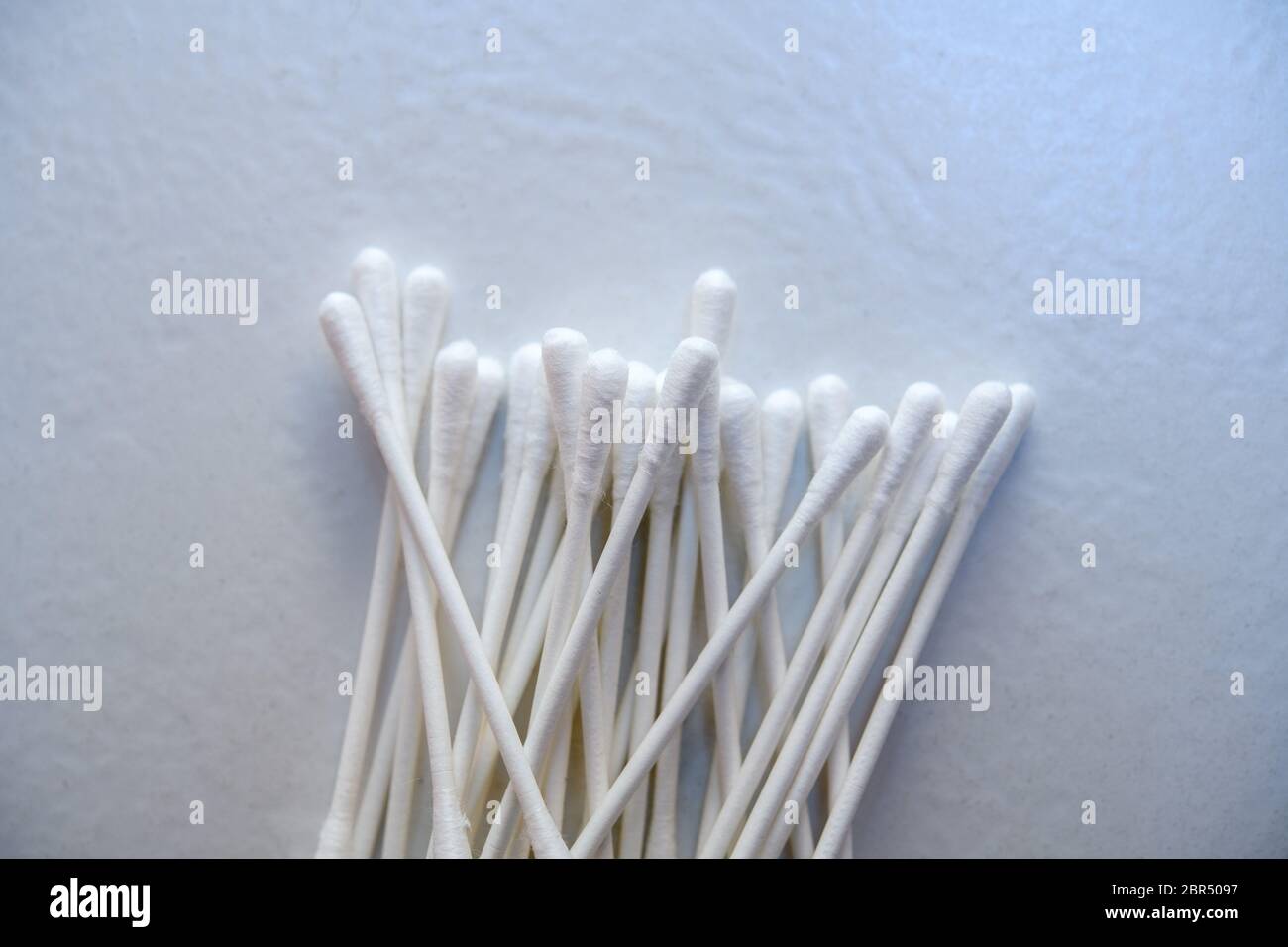 white cotton buds on bright ground Stock Photo - Alamy