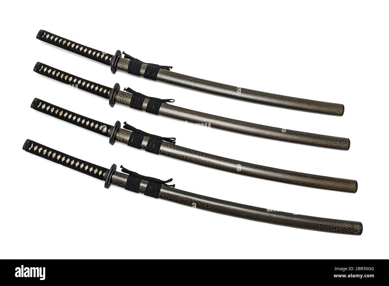 4 Japanese swords and green textured scabbard with black cord isolated ...