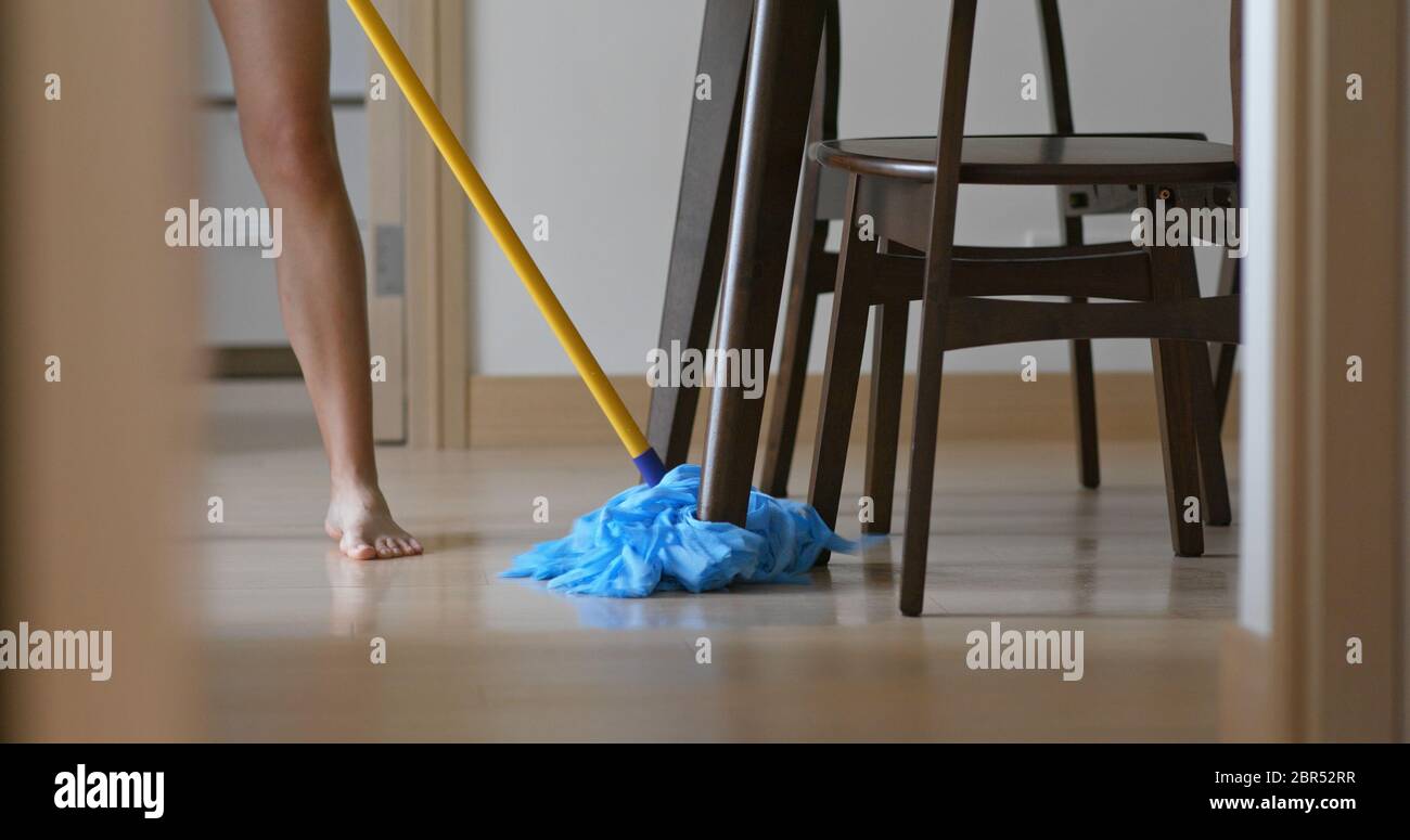 Housewife clean floor with mop Stock Photo - Alamy