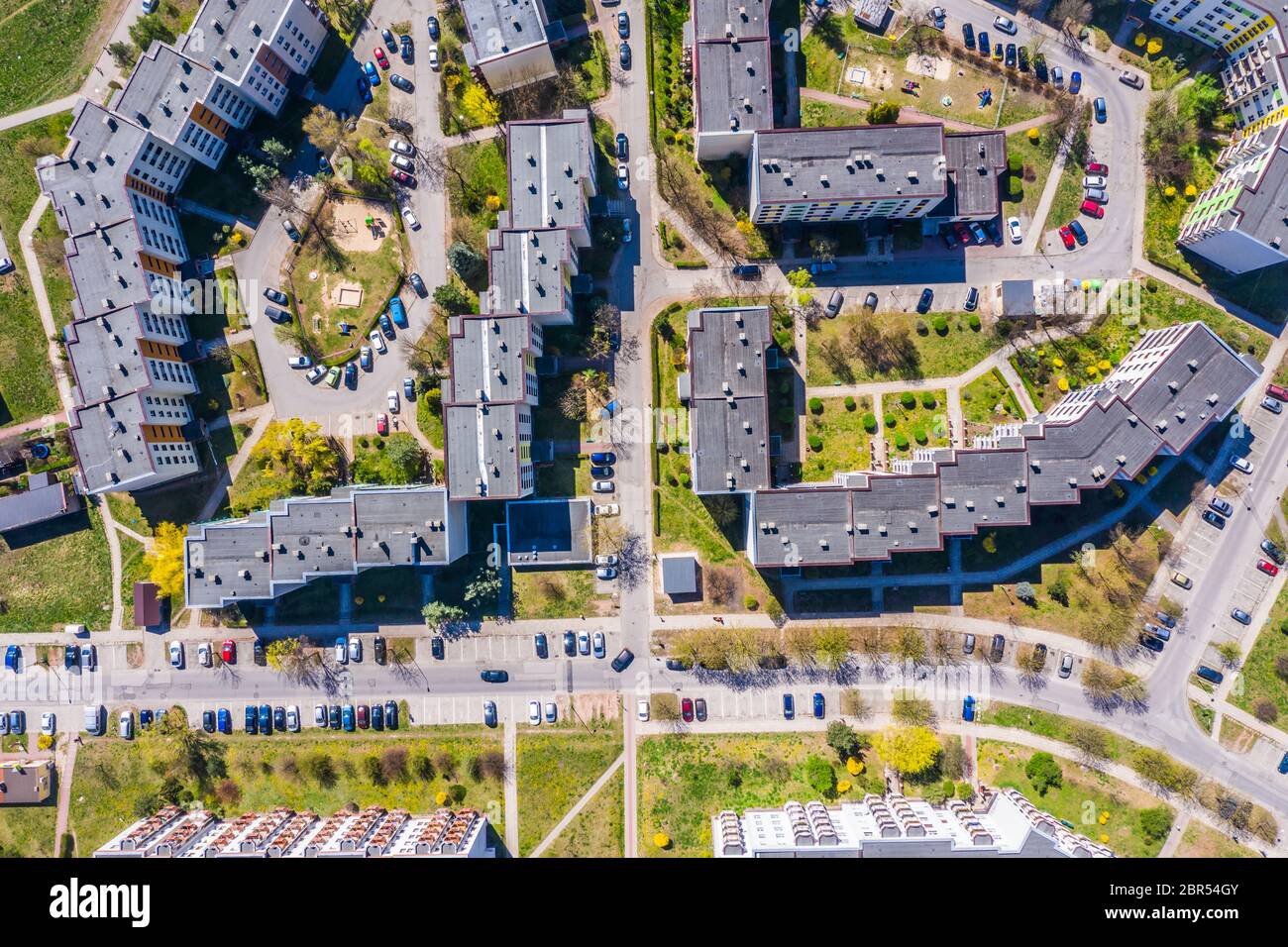 Aerial city view with crossroads and roads, houses, buildings, parks ...