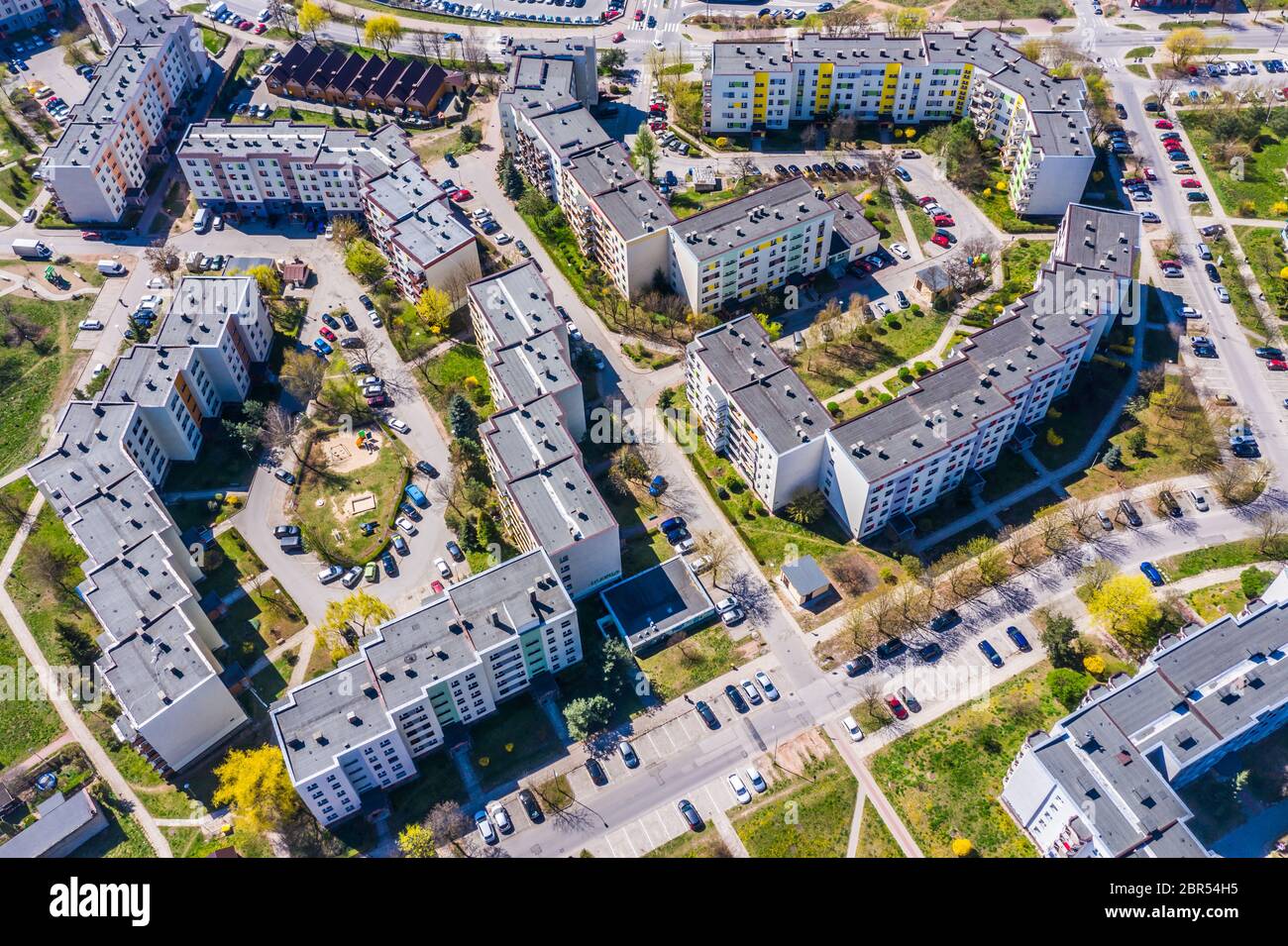 Aerial city view with crossroads and roads, houses, buildings, parks ...