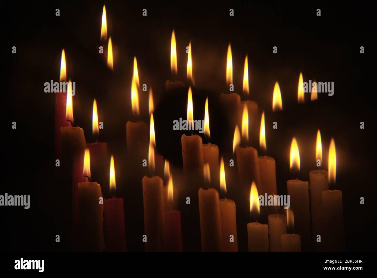 Candles flame close up on a black background Stock Photo - Alamy