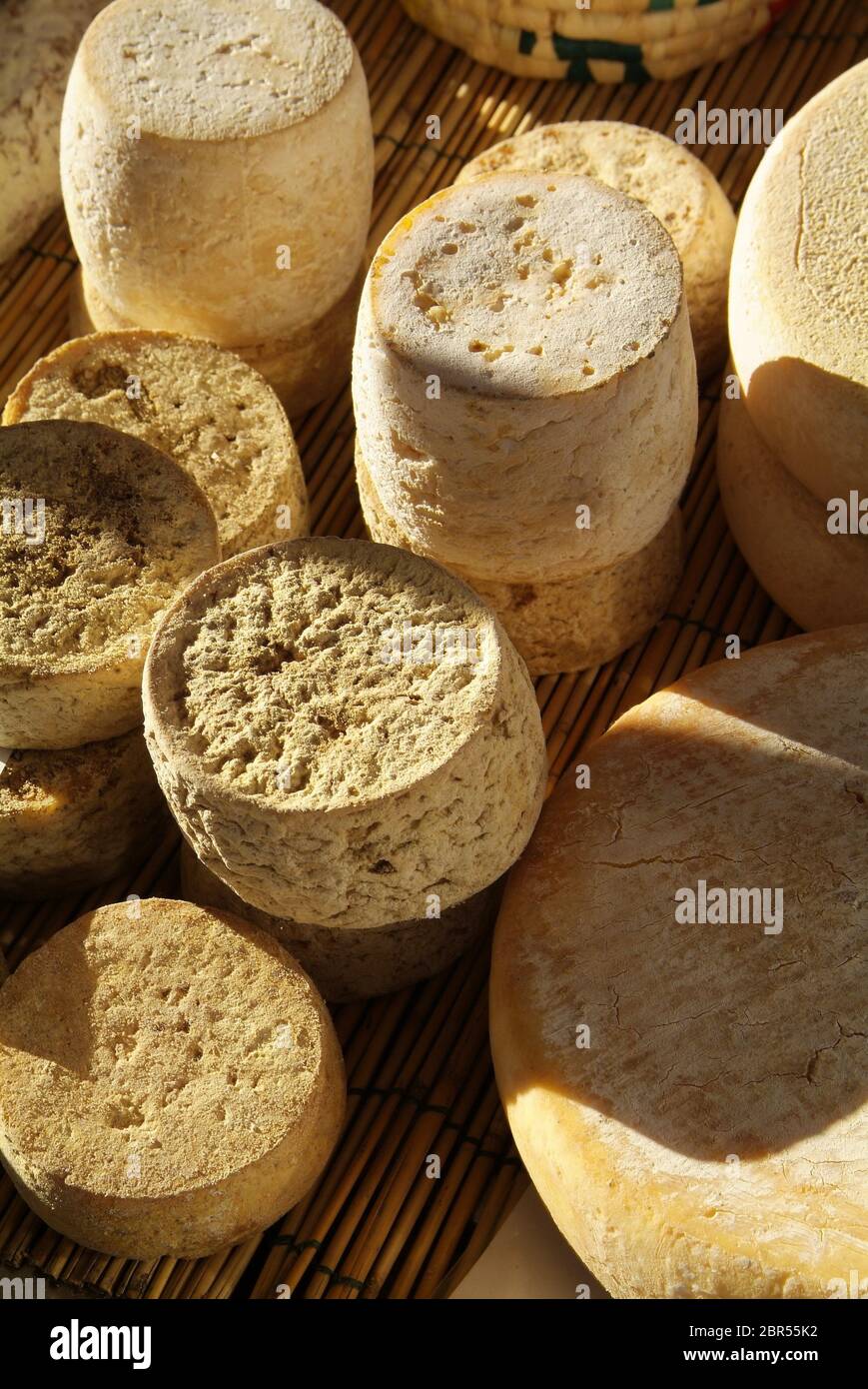 Forms with freshly made cheese on wooden table made in italy Stock ...