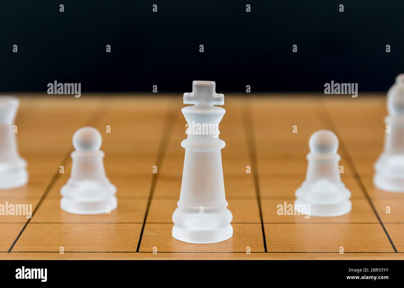 Close up chess pieces on a wood chessboard Stock Photo - Alamy