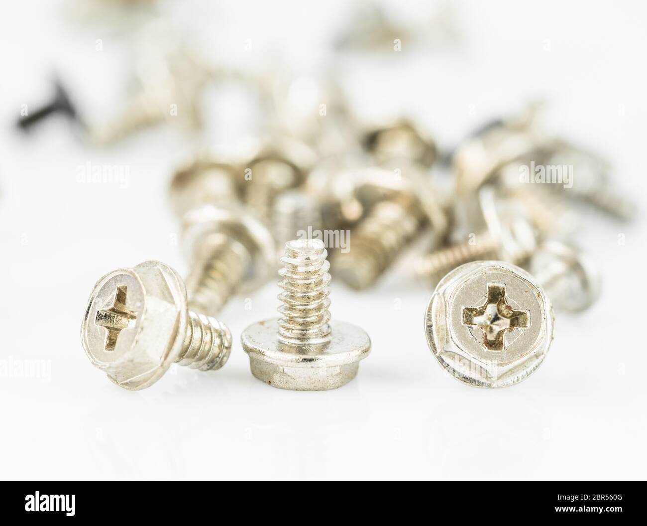 Close up set of old screws on the white background Stock Photo - Alamy