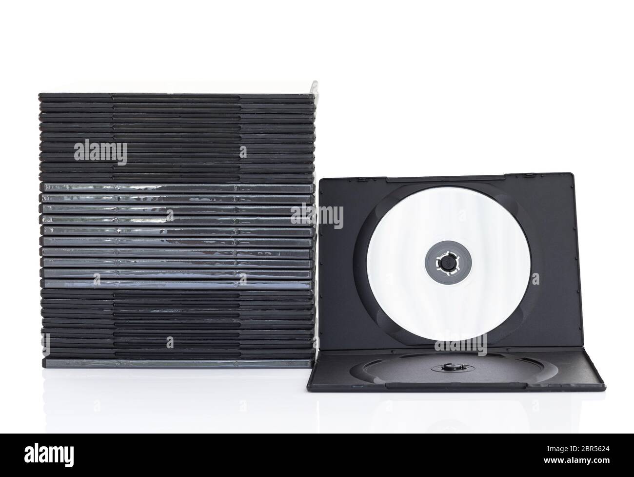 Stack of dvd boxes with disc on white background Stock Photo - Alamy