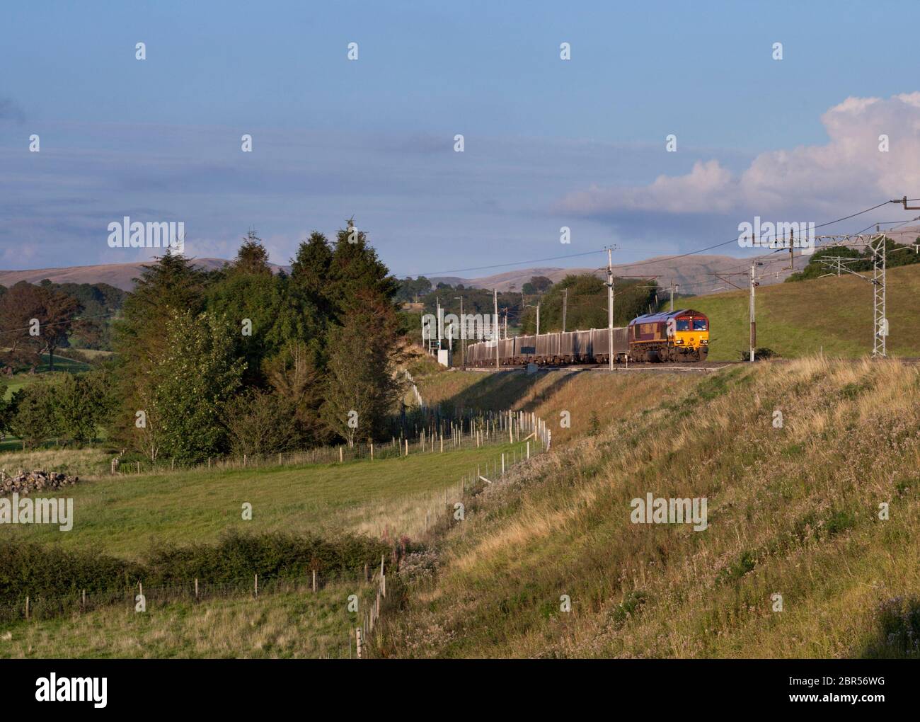 DB Cargo class 66 locomotive in EWS livery passing Lambrigg (north of ...