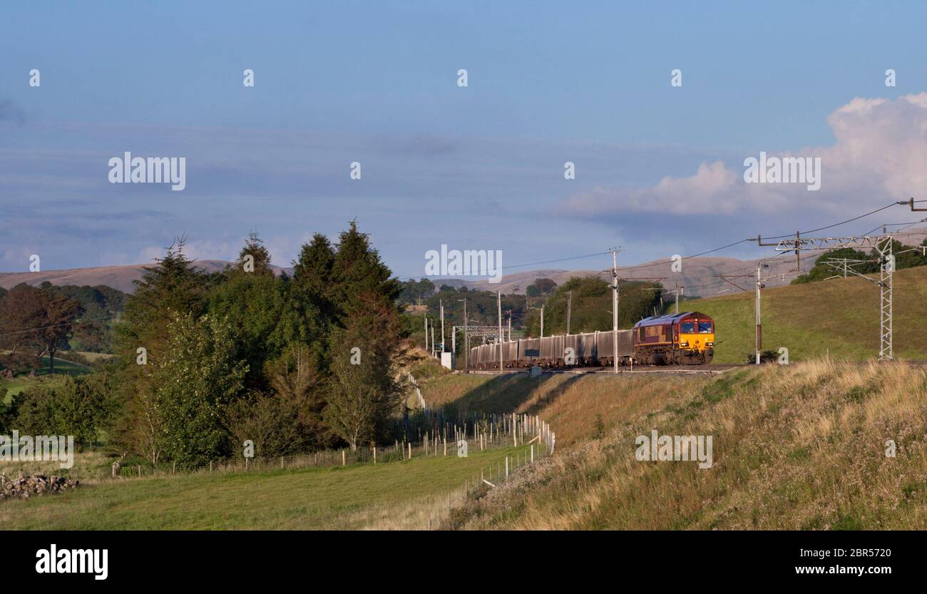 DB Cargo class 66 locomotive in EWS livery passing Lambrigg (north of ...