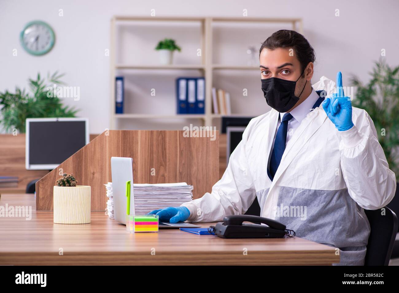 Young male employee in the self-isolation concept Stock Photo - Alamy
