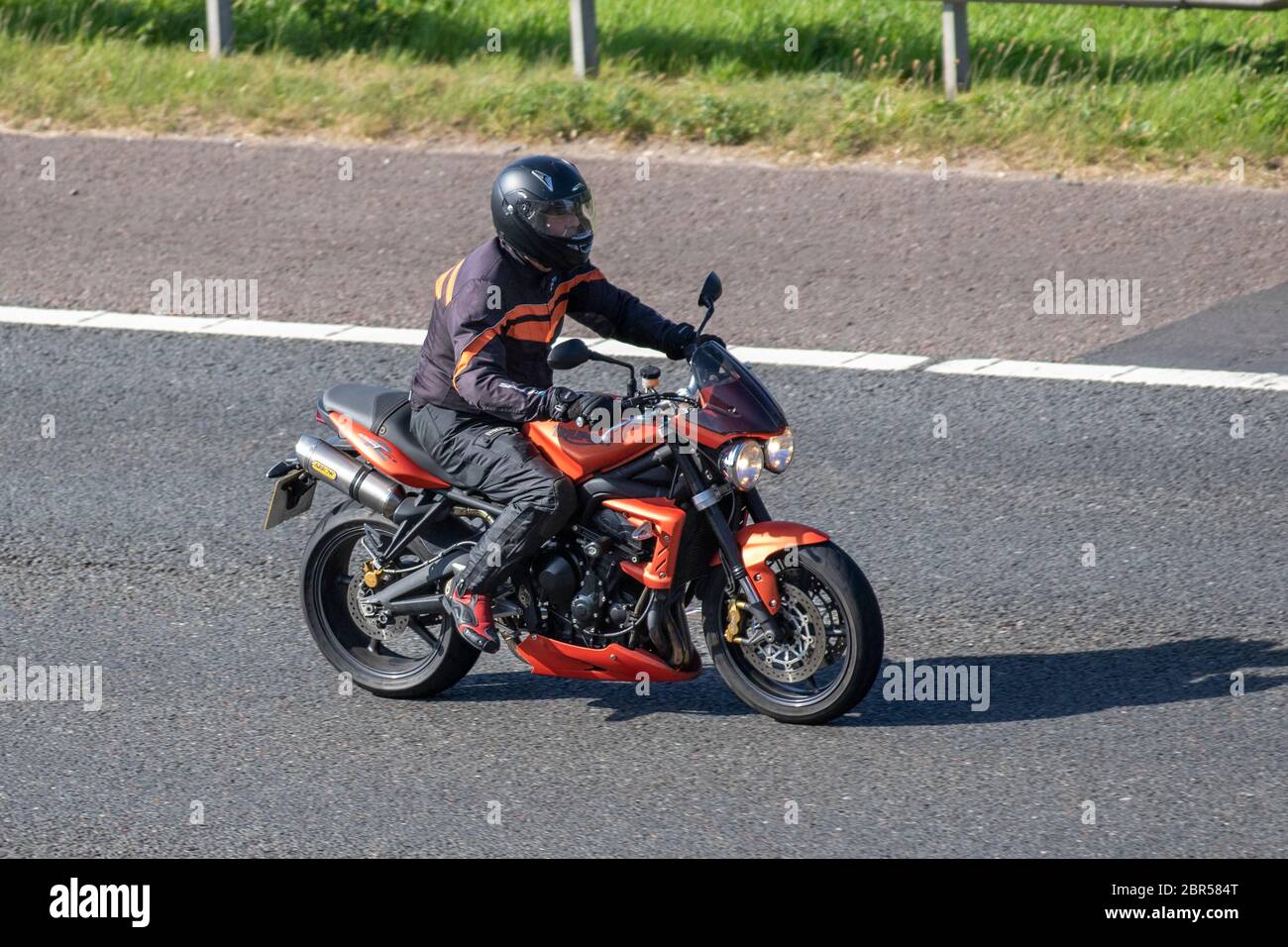 Triumph Street triple:Motorbike rider; two wheeled transport ...