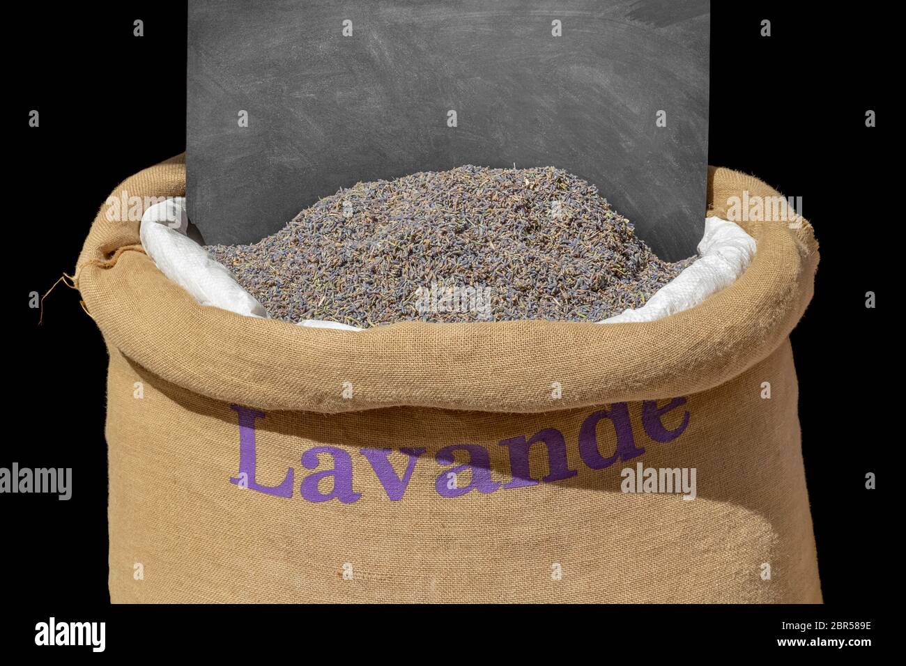 gunnysack filled with lavender blossoms in black back Stock Photo - Alamy