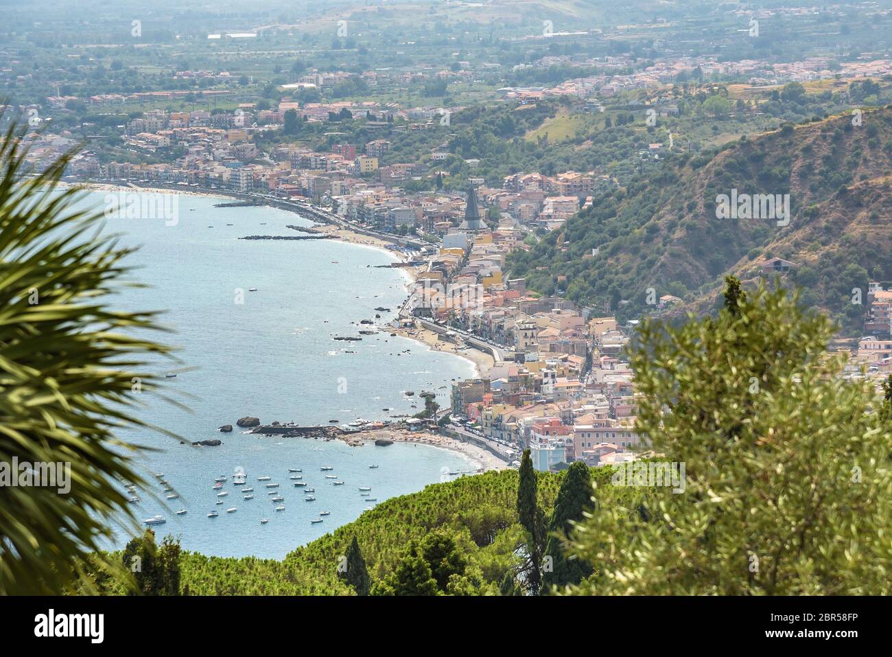 View of Giardini Naxos town from Taormina, Sicily, Italy Stock Photo ...