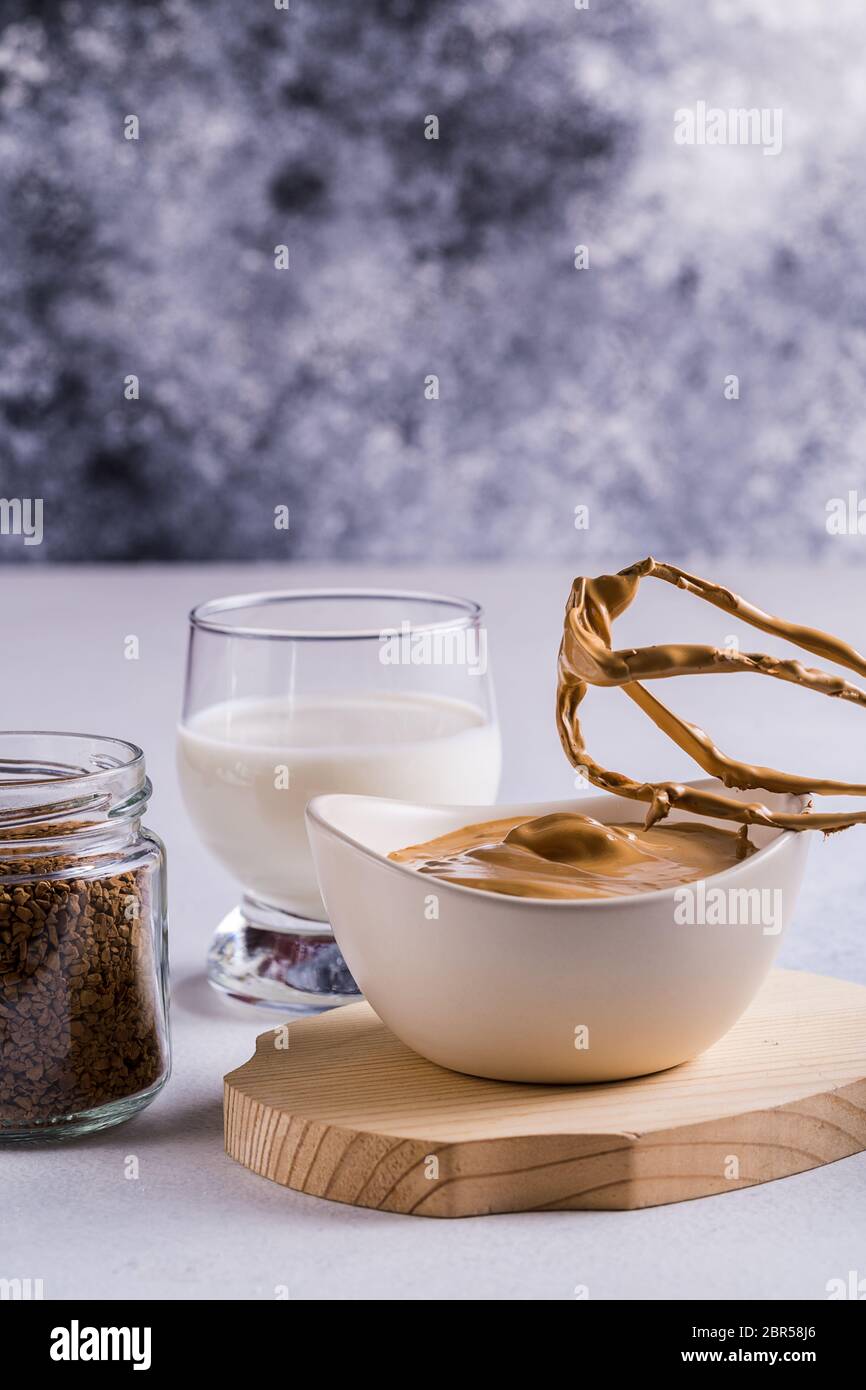 Cooking Dalgona Coffee with whipped foam . Dalgona coffee cream made ...
