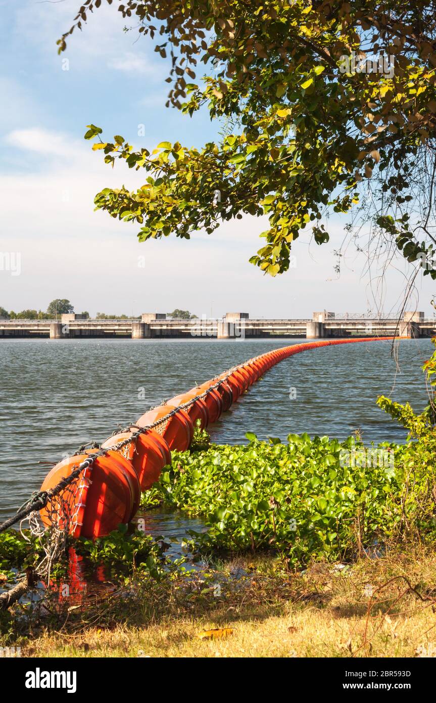 Orange Waste trap buoys in the river near dam Stock Photo - Alamy