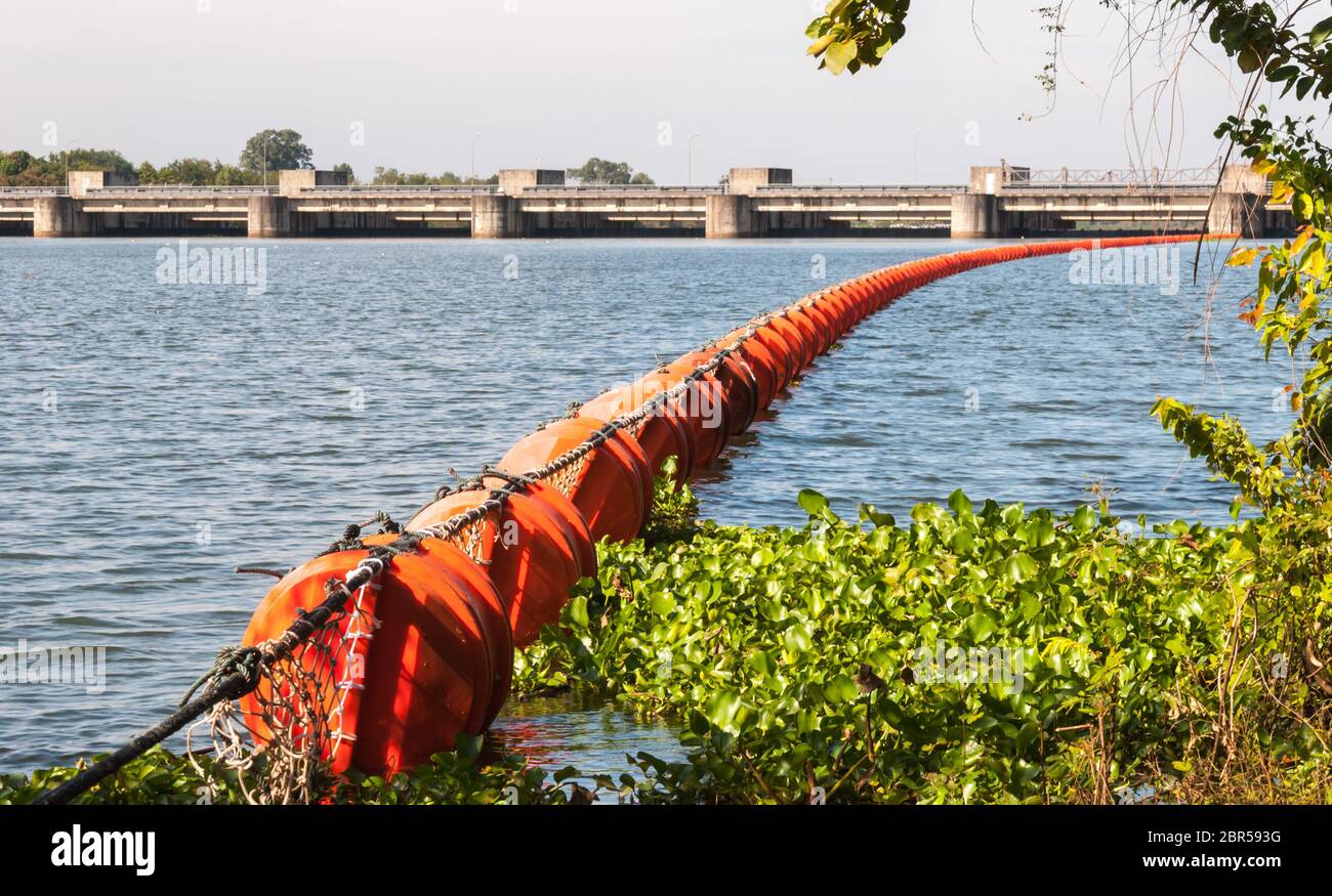 Orange Waste trap buoys in the river near dam Stock Photo - Alamy