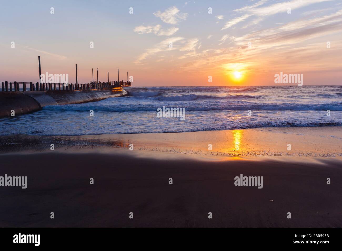 Beach Pier fishermen silhouetted ocean waves sunrise reflections ...