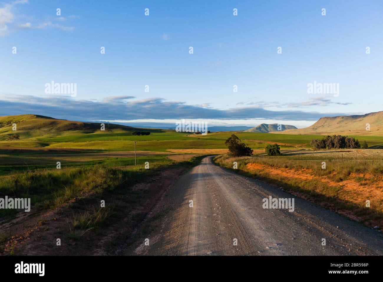 Dirt road route through scenic rural mountain farming terrain Stock ...